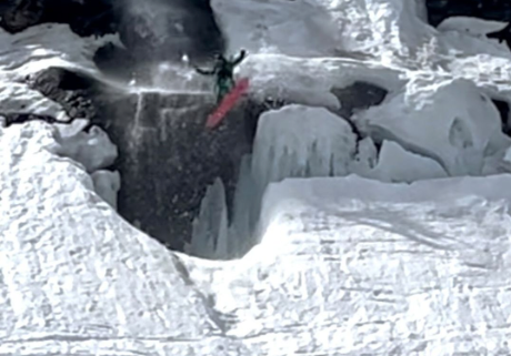 WATCH: Onlookers Gasp as Snowboarder Falls Into Massive Hole
