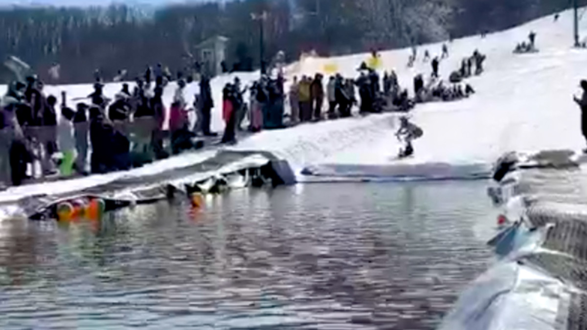 Crowd Explodes With Laughter At Snowboarder's Pond Skim Fail (Watch)