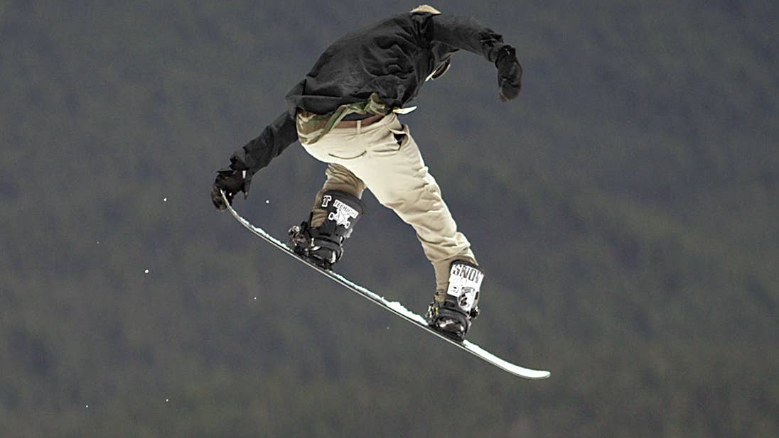 How to do a Nose Grab on a Snowboard - Snowboarder