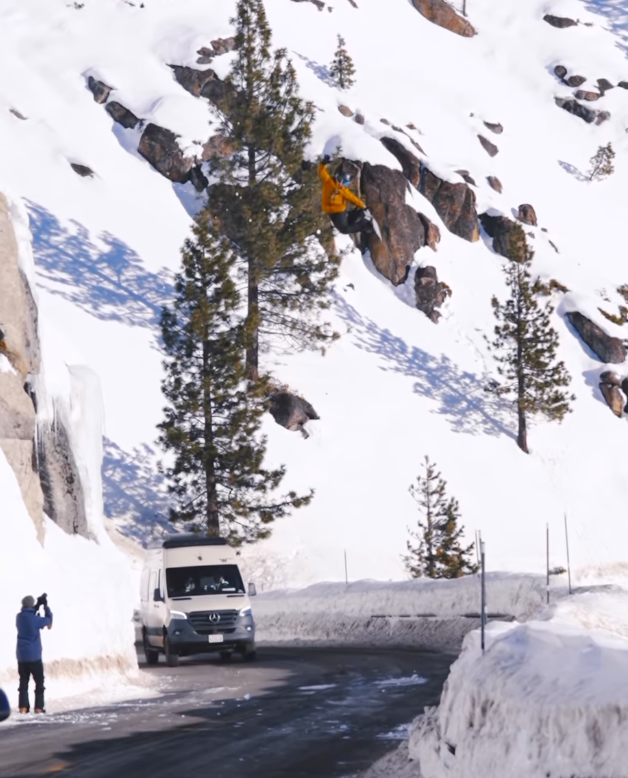 Watch: Snowboarder Jumps Moving Cars On Iconic Roadway - Snowboarder